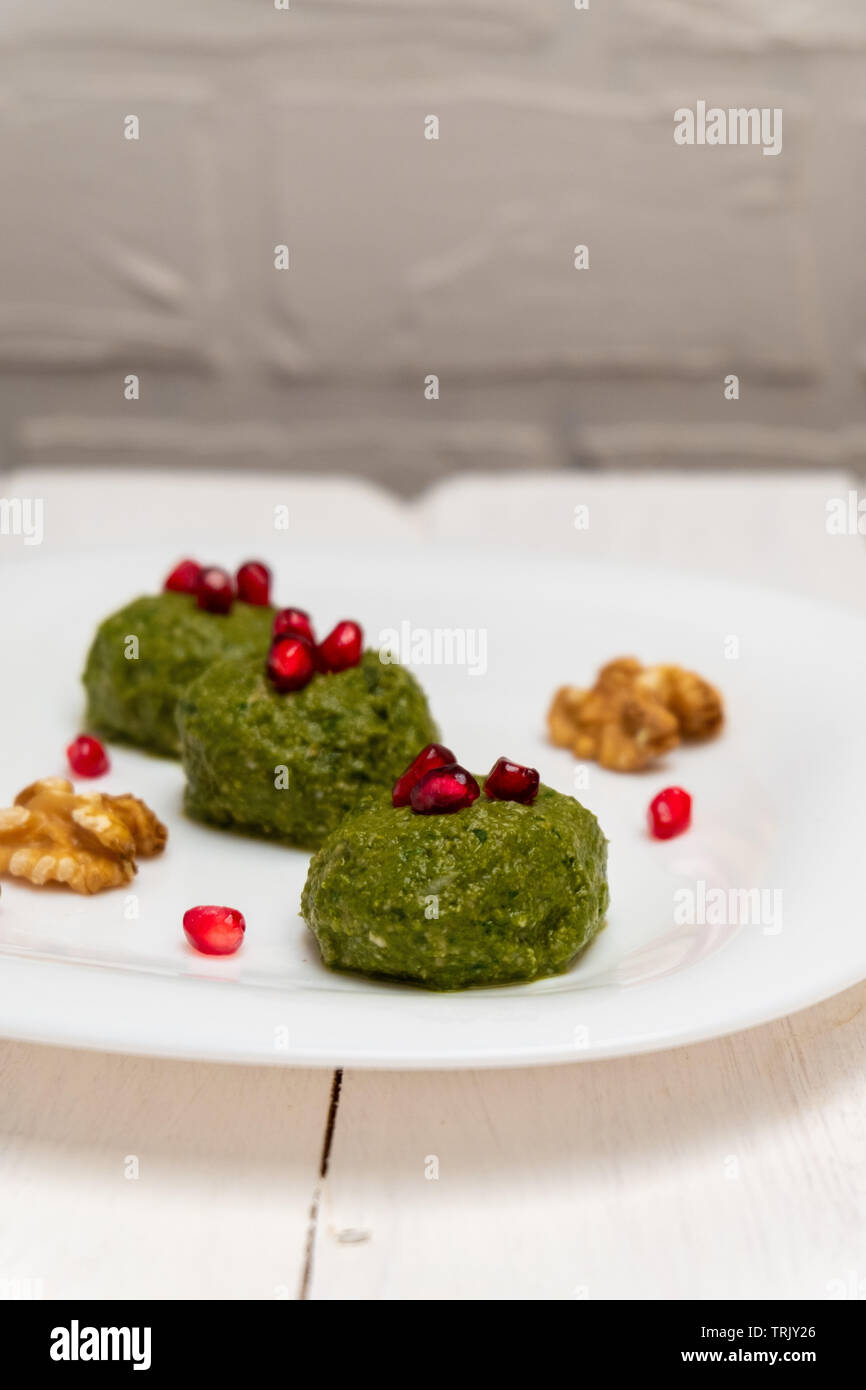 Spinach balls called Pkhali, traditional Georgian cuisine, on white ...