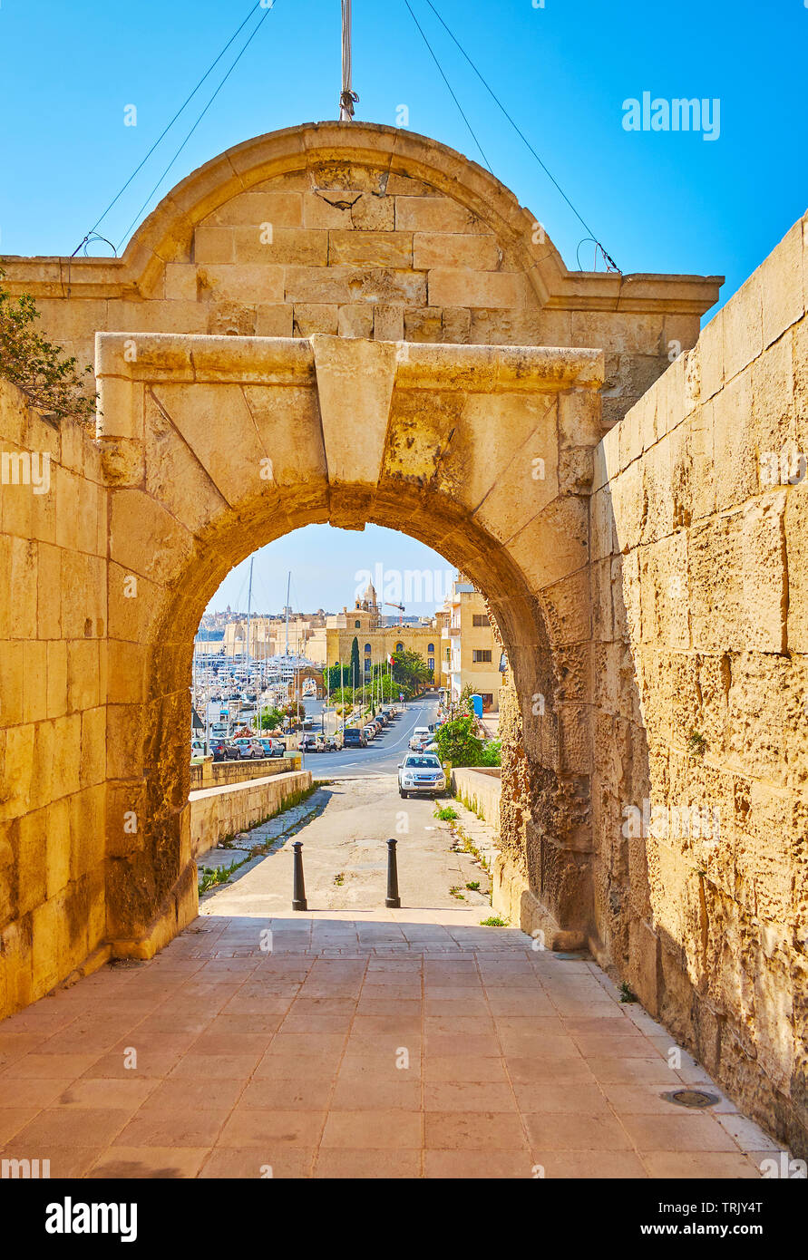 The view on the Birgu city through the medieval outer gate of ...