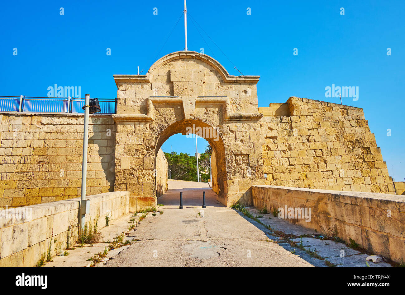 The old stone rampart and preserved outer gate of Vittoriosa fortress ...