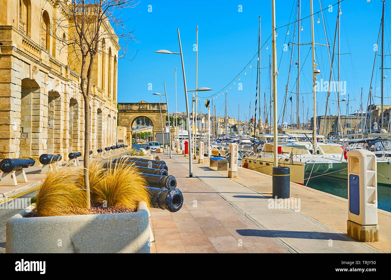 The old Xatt Il-Forn promenade is decorated with old cannons, standing ...