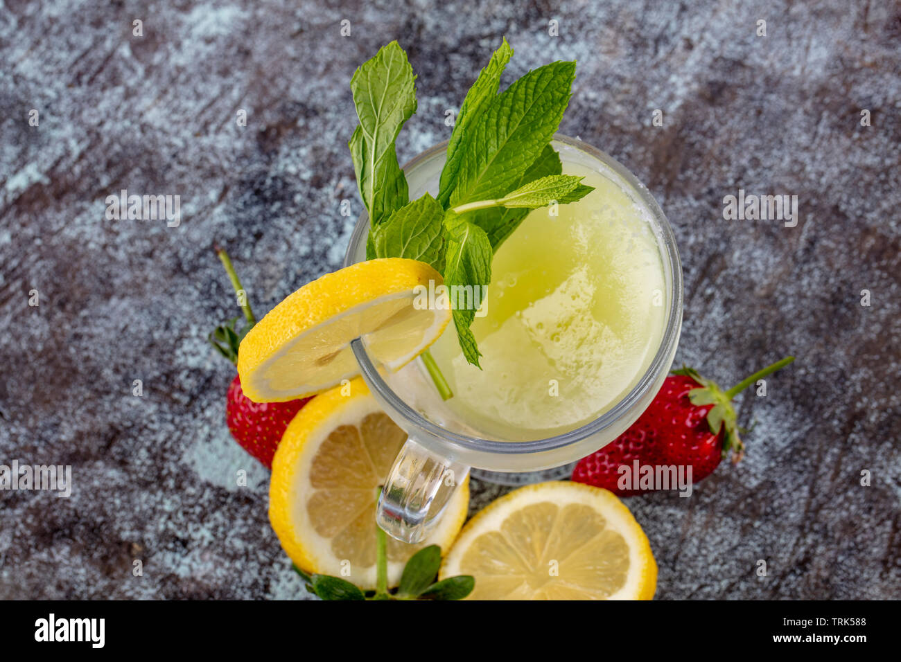 Lemonade with ice. Fresh lemonade with strawberry, mint shot top down ...