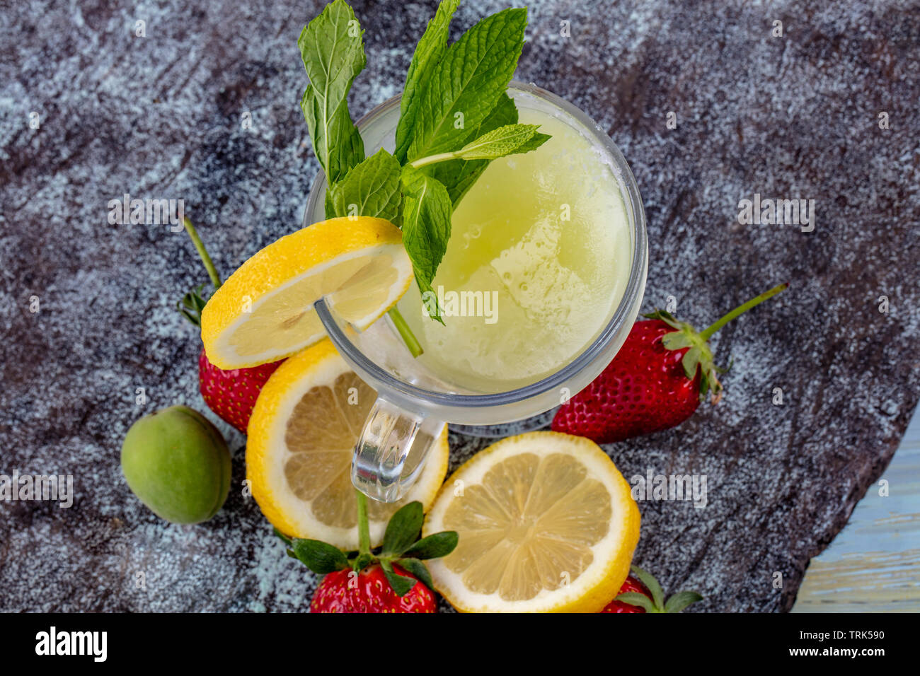 Lemonade with ice. Fresh lemonade with strawberry, mint shot top down ...