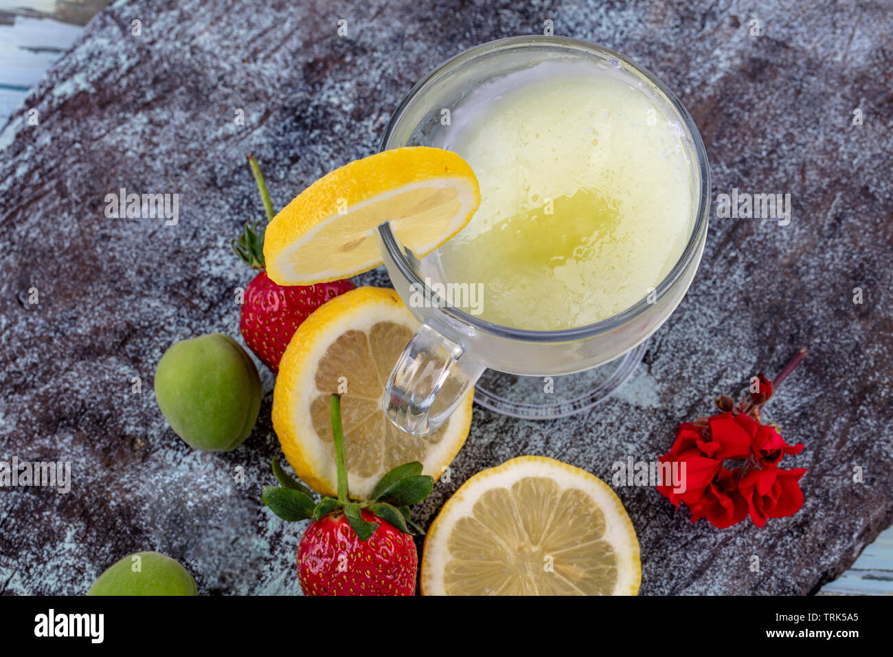 Lemonade with ice. Fresh lemonade with strawberry, mint shot top down ...