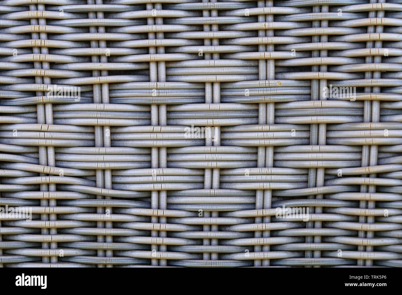 Rattan chair in a closeup. Beautiful symmetric texture of the surface ...