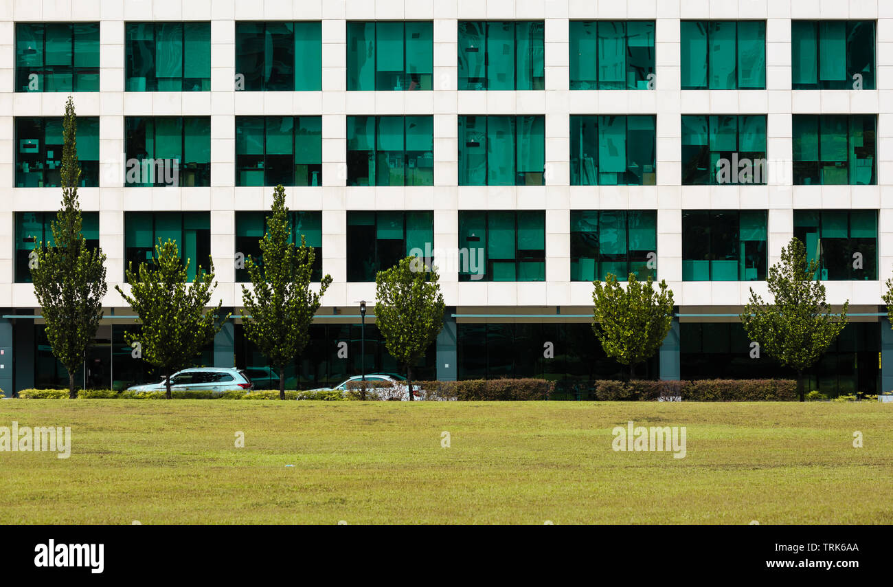simple building facade and front big lawn Stock Photo - Alamy