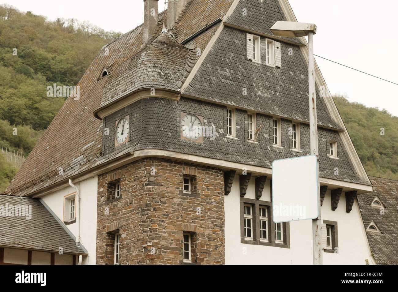 White road sign in front of the Moselkern train station - Gothic ...