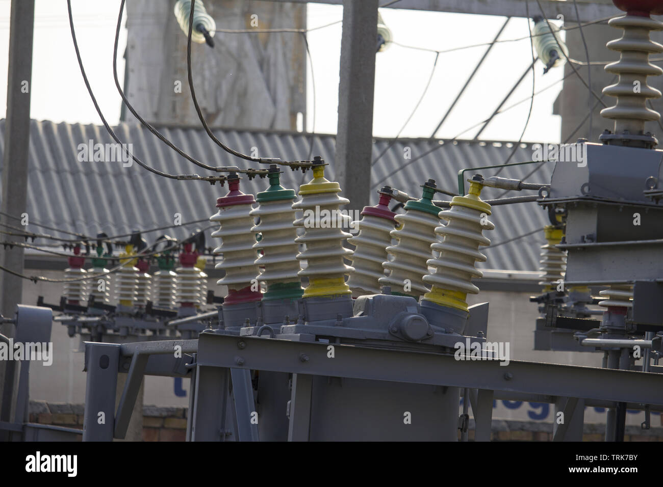 Close up of ceramic isolators on High voltage electricity ...