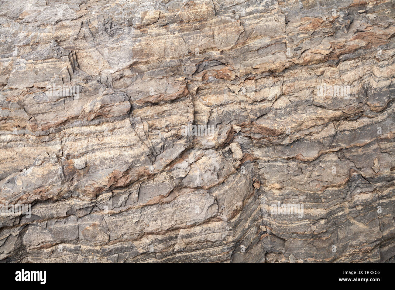 Rough brown stone wall, natural rock surface background photo texture ...