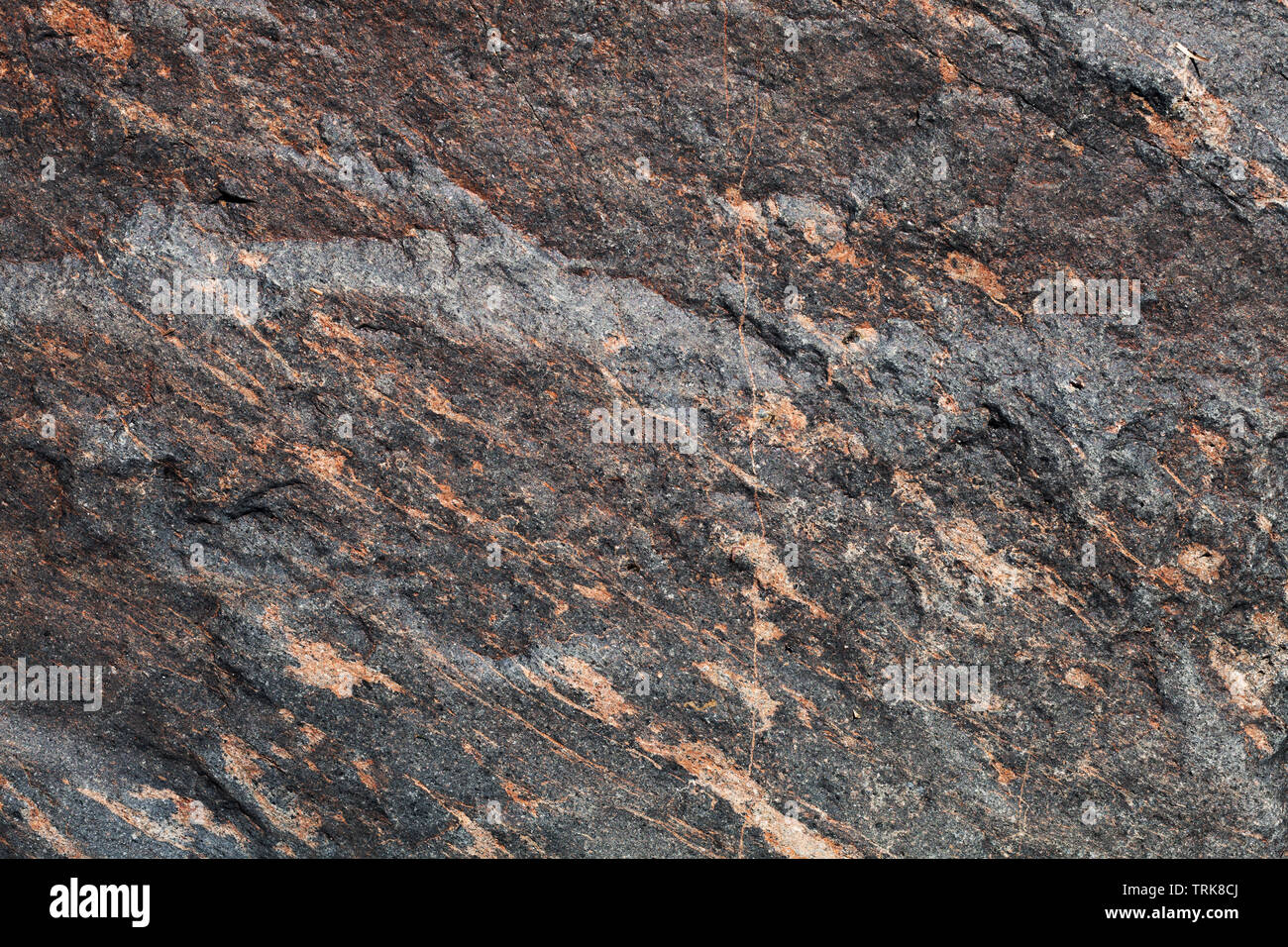 Natural dark gray and red stone background photo texture with relief ...