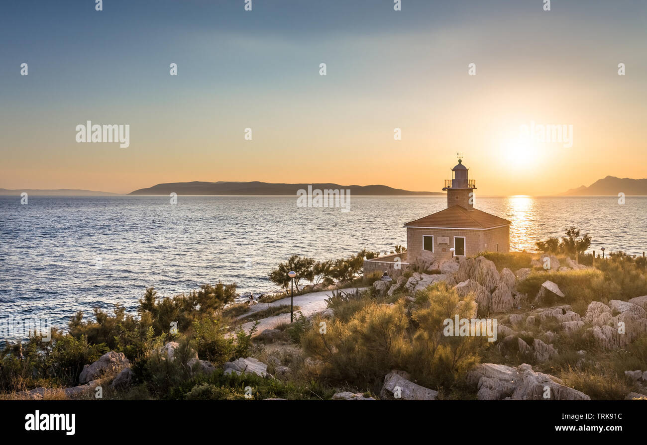 Seashore lighthouse sunset hi-res stock photography and images - Alamy