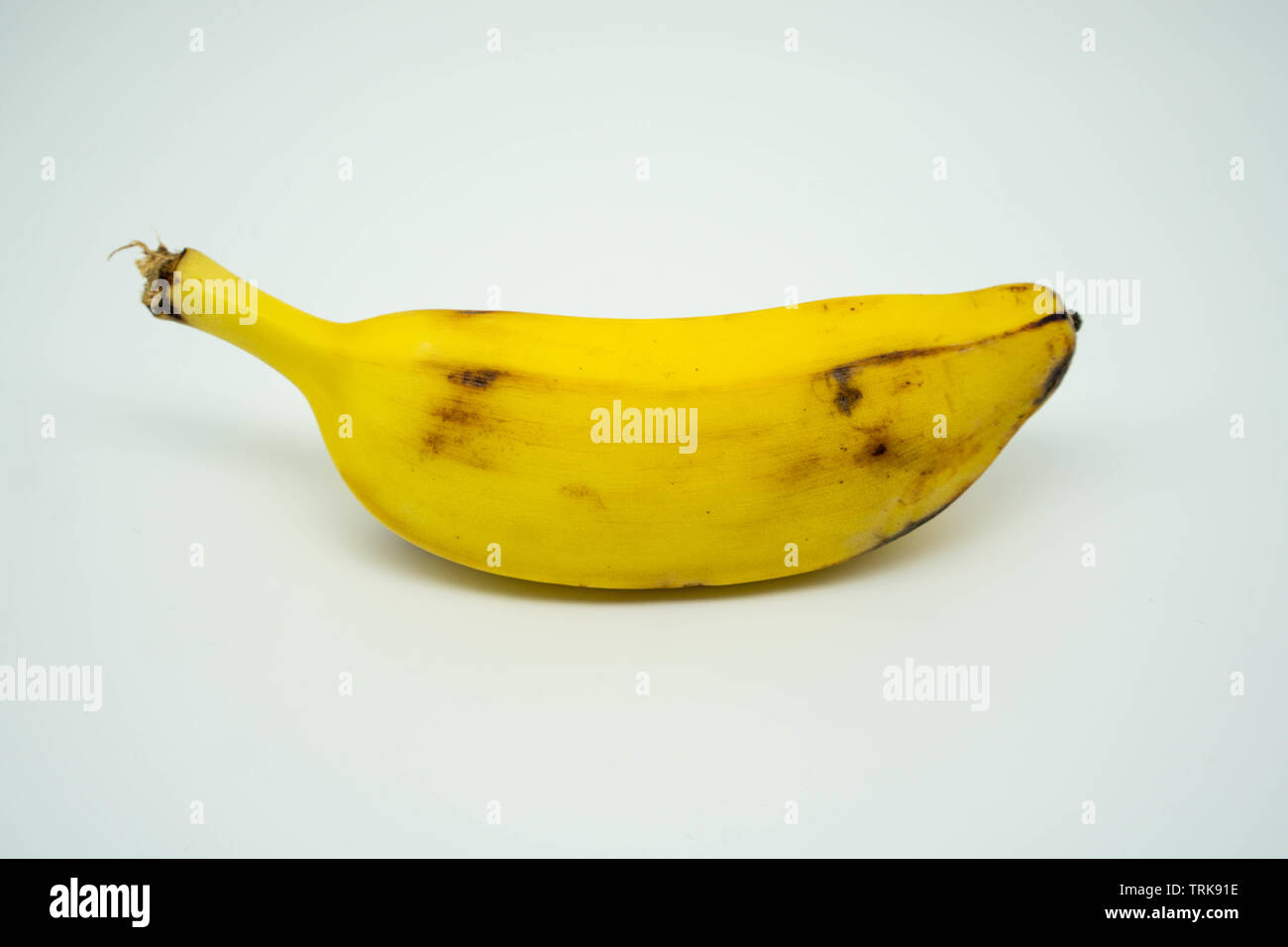single ripe short banana on an isolated white background Stock Photo ...