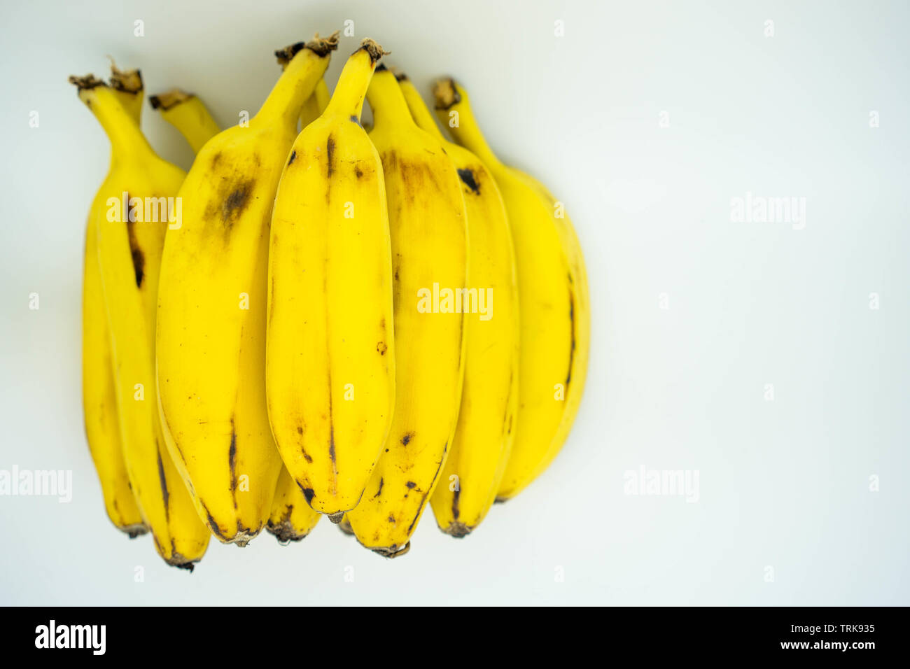 bunch of ripe bananas stacked up with copy space overhead Stock Photo ...