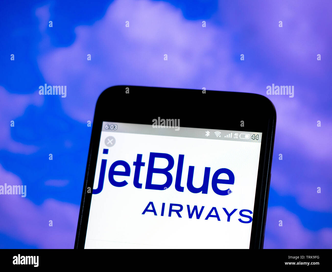 In this photo illustration the JetBlue Airways logo is seen displayed ...