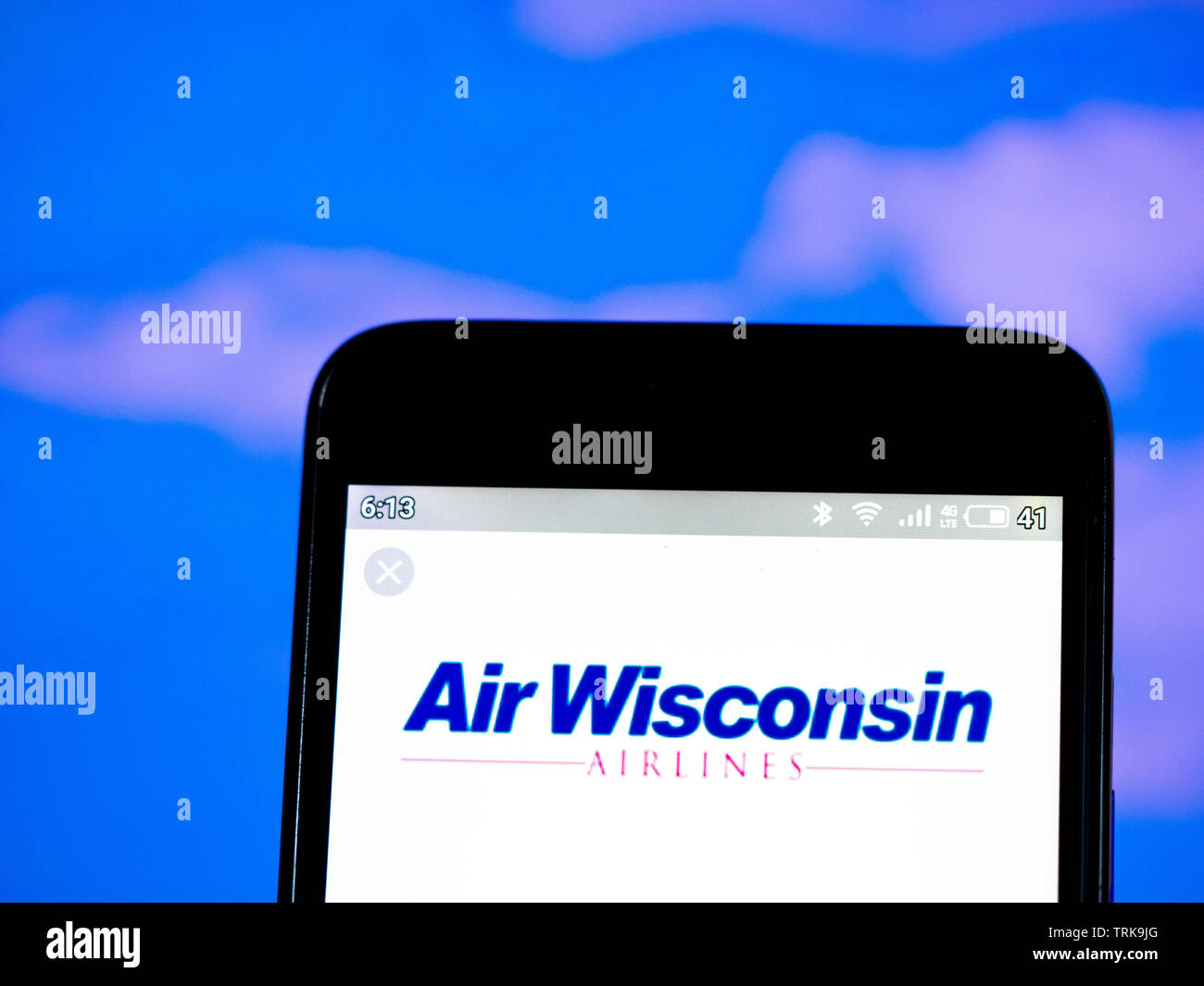 In this photo illustration the Air Wisconsin logo is seen displayed on ...