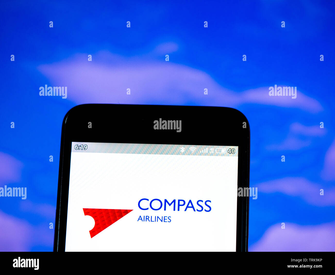 In this photo illustration the Compass Airlines logo is seen displayed ...