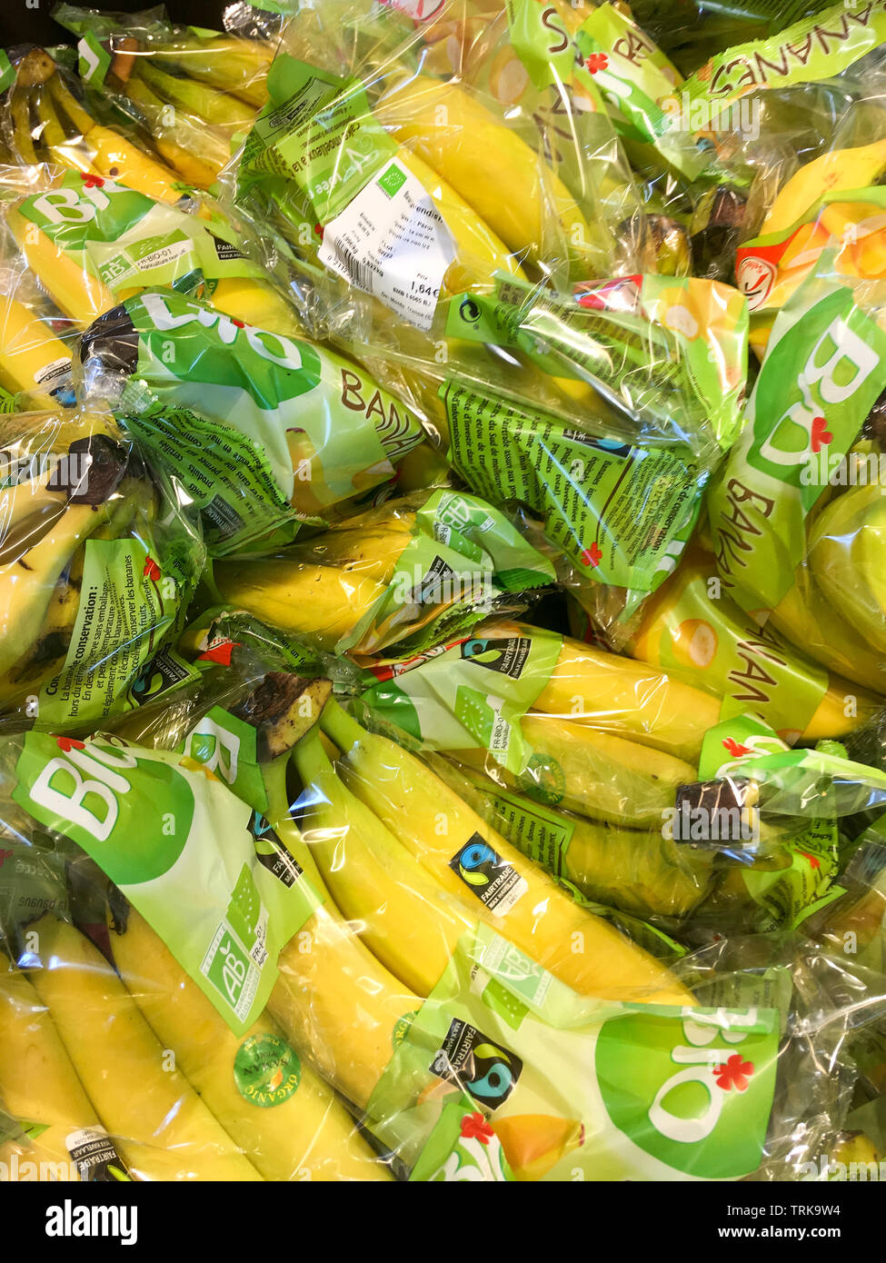 Organic bananas packaged in plastic blister packs, France Stock Photo ...