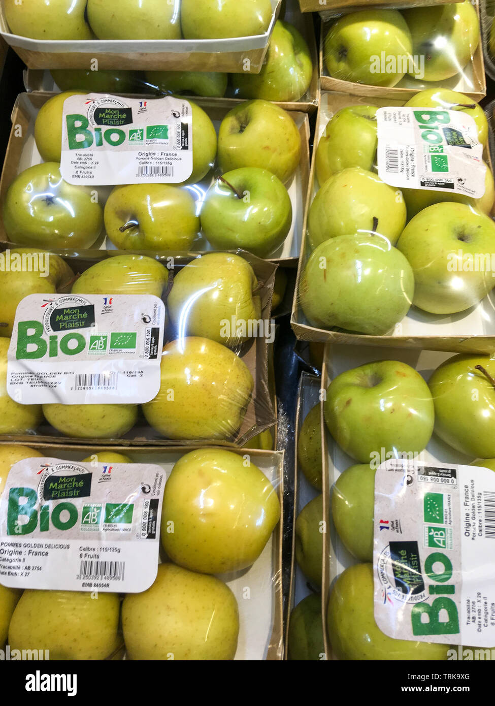 Organic apples packaged in plastic blister packs, France Stock Photo ...