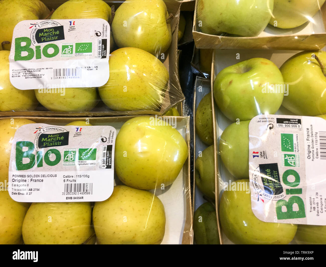 Organic apples packaged in plastic blister packs, France Stock Photo ...