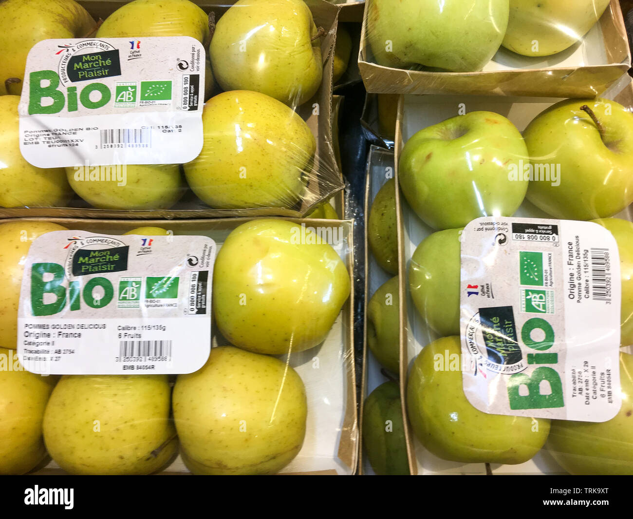 Organic apples packaged in plastic blister packs, France Stock Photo ...