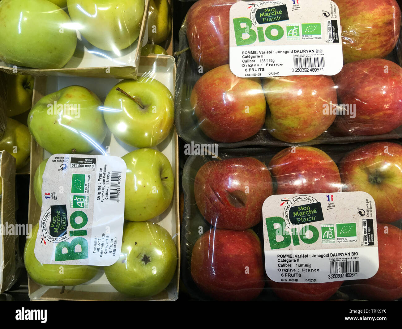 Organic apples packaged in plastic blister packs, France Stock Photo ...