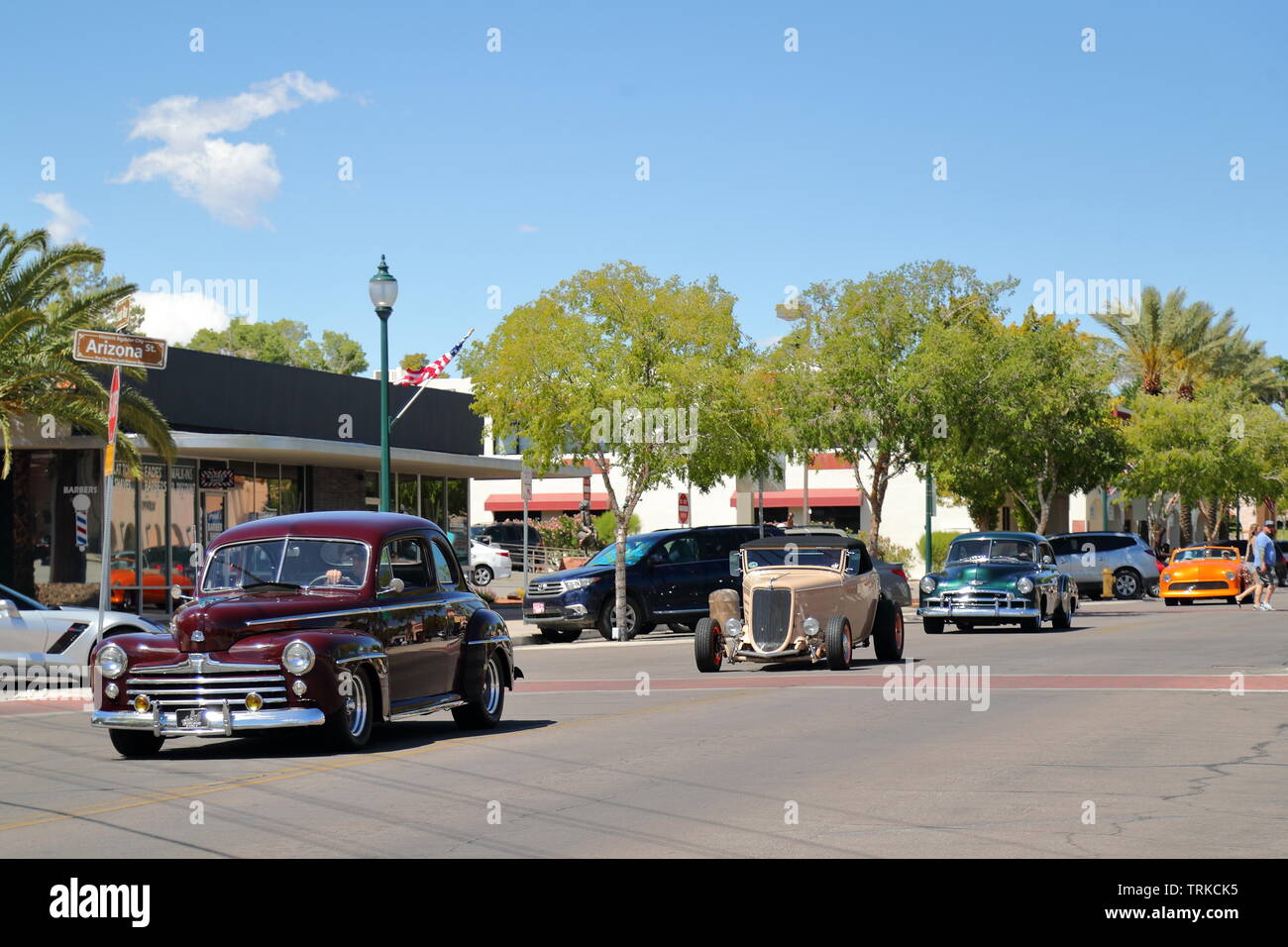 A procession of vintage cars and hot rods on memorial day in Boulder ...