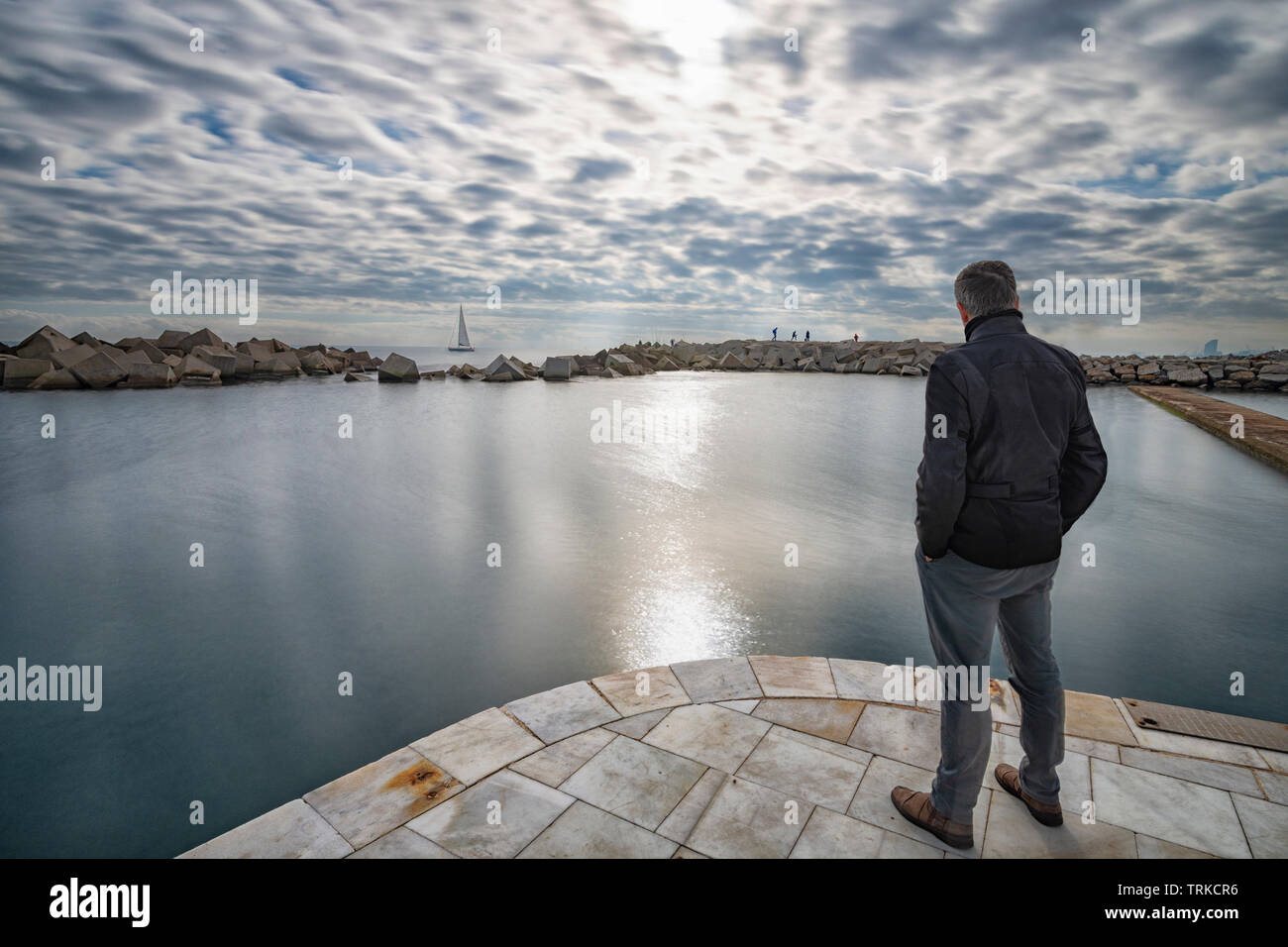 Contemplating the sea cloudy day Stock Photo - Alamy