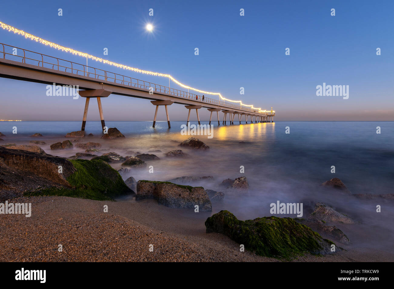 illuminated bridge on the beach Stock Photo - Alamy