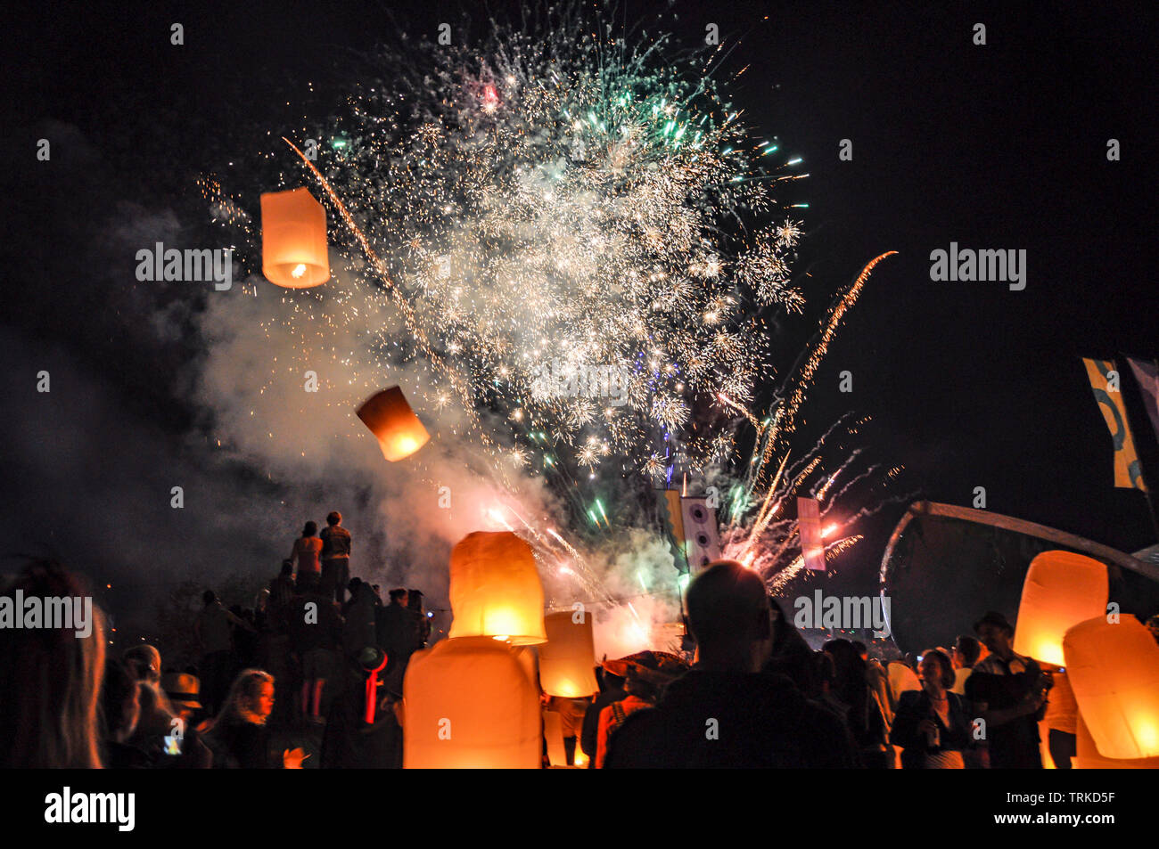 Festival Lantern lift-off with fireworks Stock Photo - Alamy
