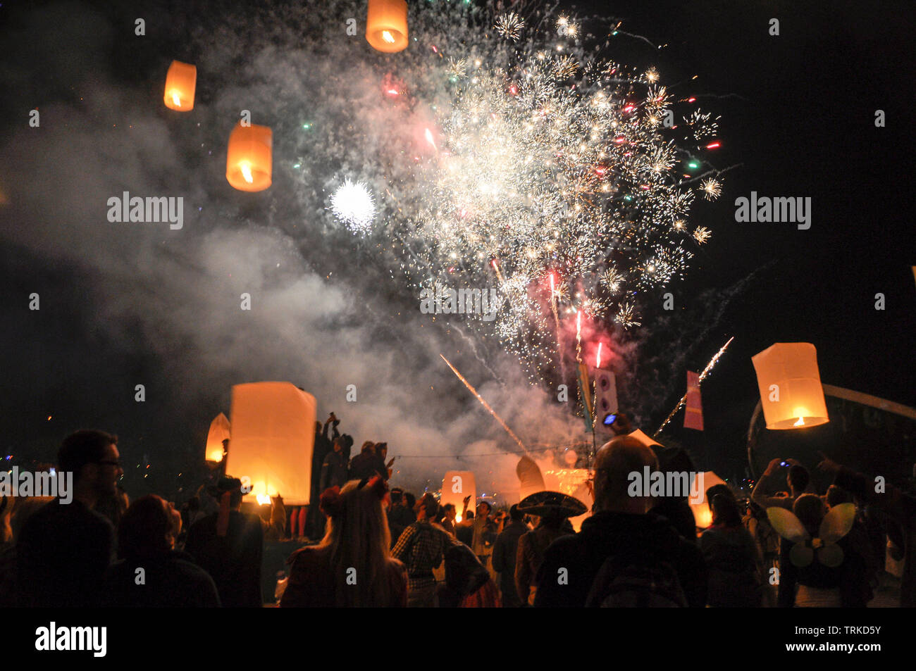 Festival Lantern lift-off with fireworks Stock Photo - Alamy