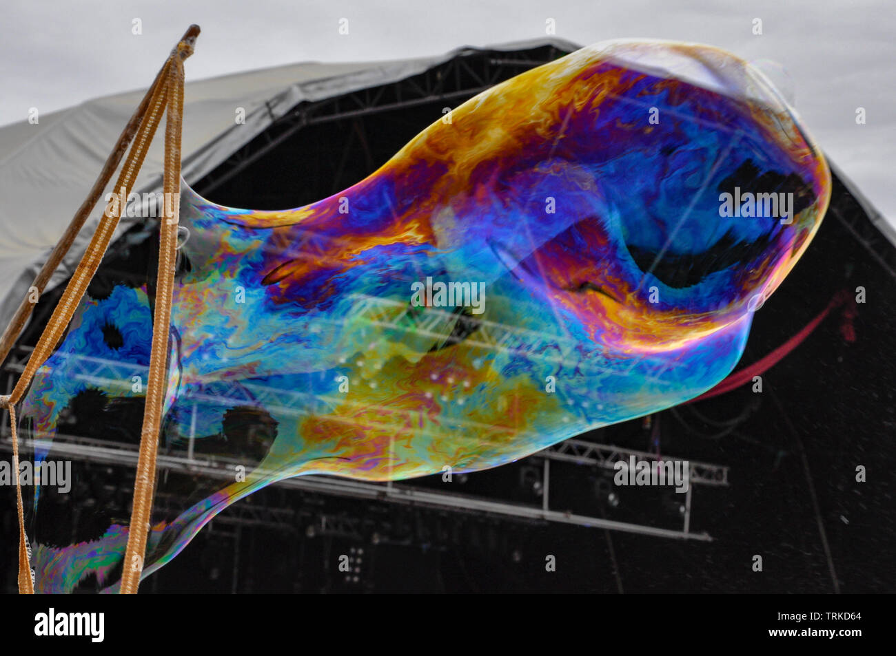 Giant bubble against festival stage Stock Photo - Alamy