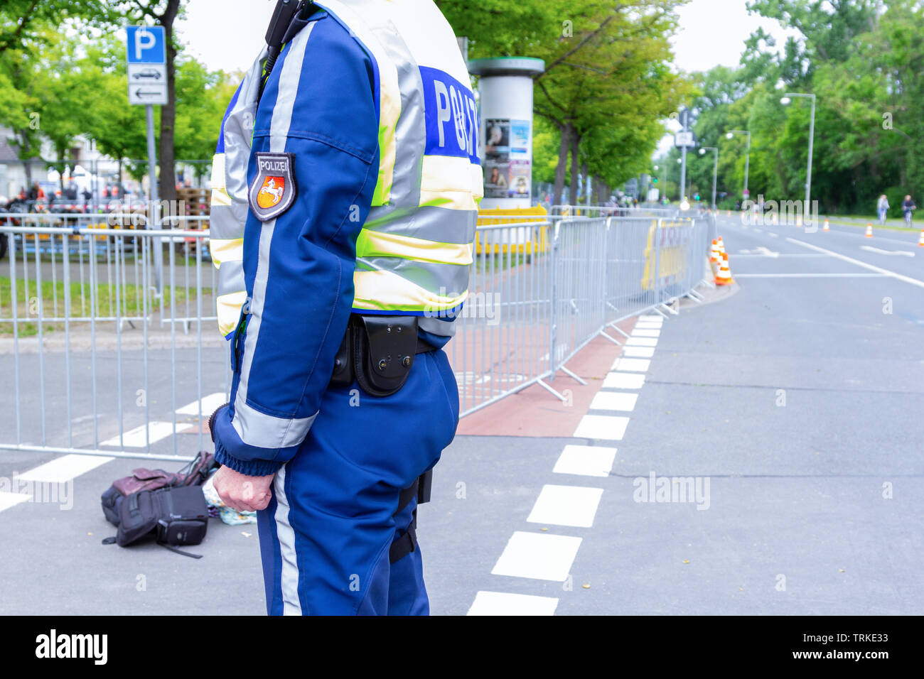 HANOVER / GERMANY - MAY 25, 2019: German police officer stands on a ...