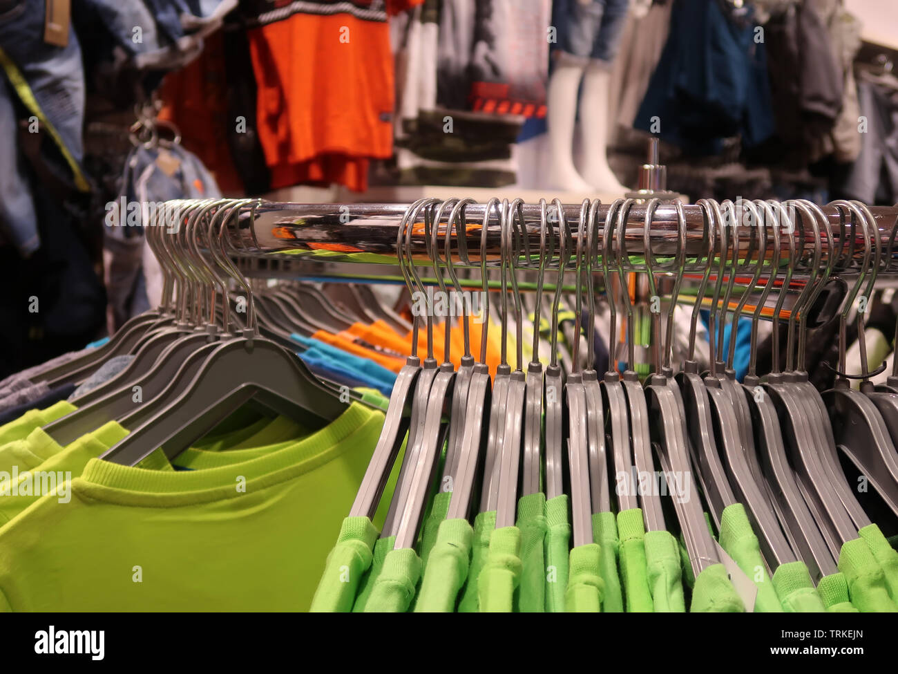 Clothes hanging in a shopping mall Stock Photo - Alamy