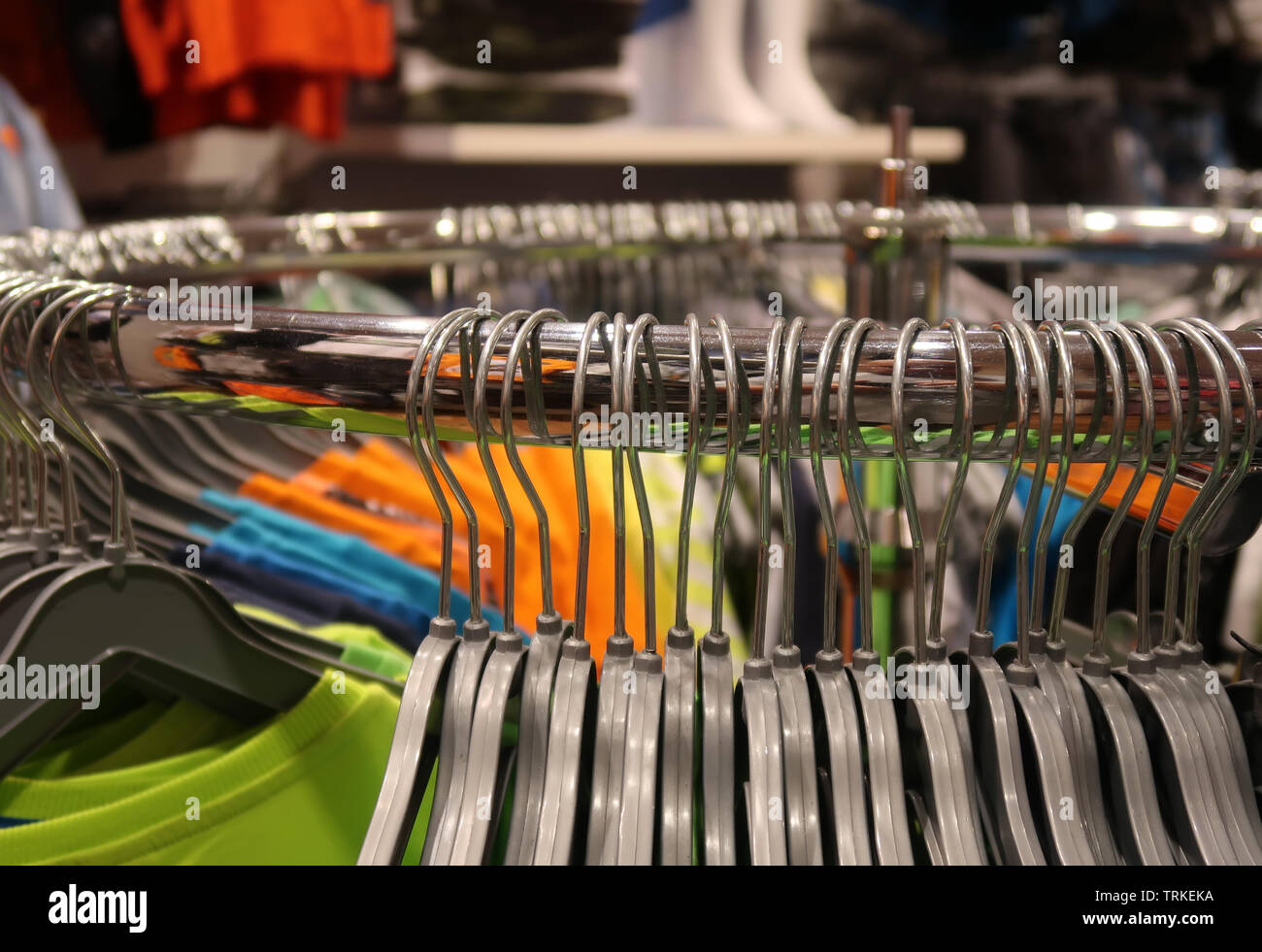 Clothes hanging in a shopping mall Stock Photo - Alamy