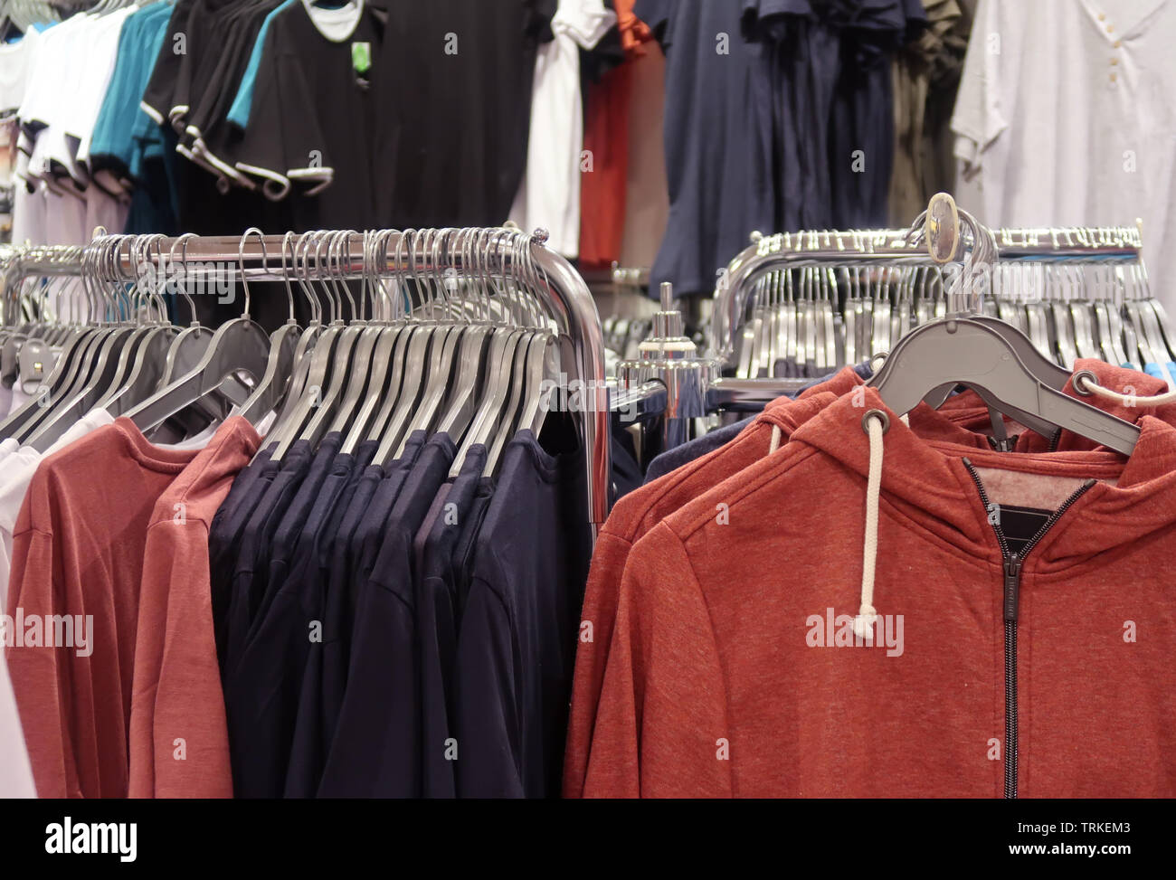 Clothes hanging in a shopping mall Stock Photo - Alamy
