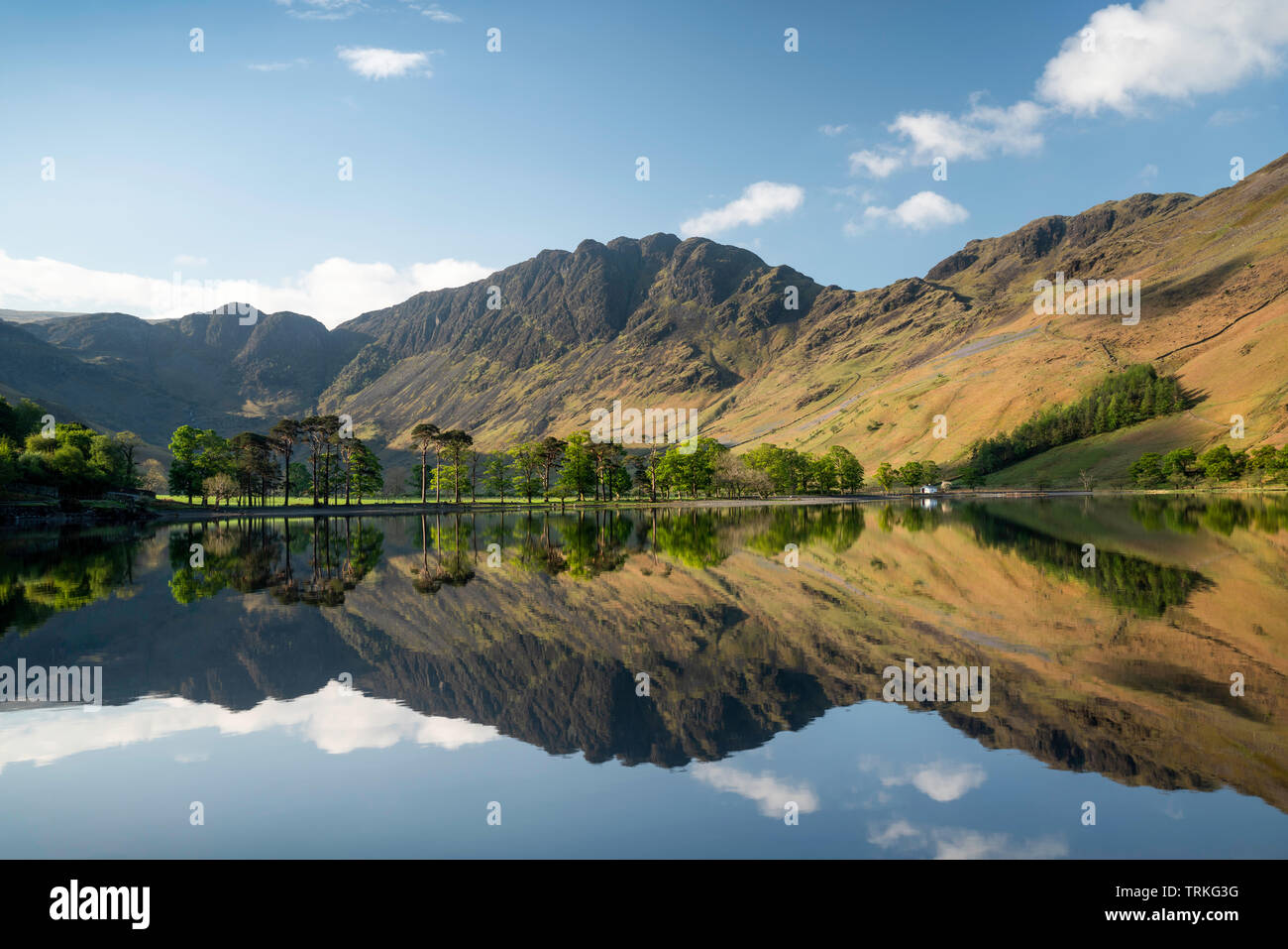 Early morning Summer reflections of Haystacks fell and the famous ...