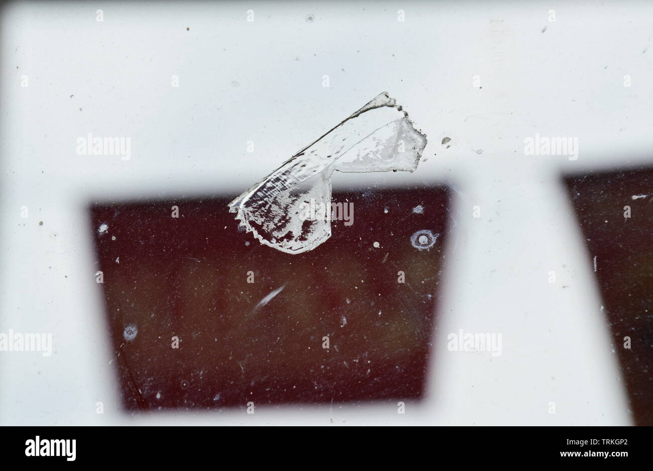 adhesive tape stain on window glass shield and wash bubble Stock Photo ...