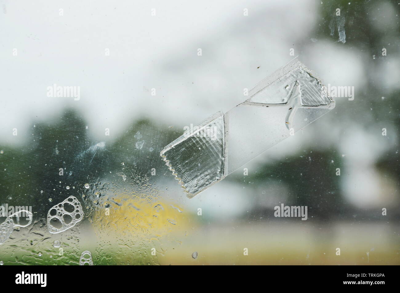 adhesive tape stain on window glass shield and wash bubble Stock Photo ...