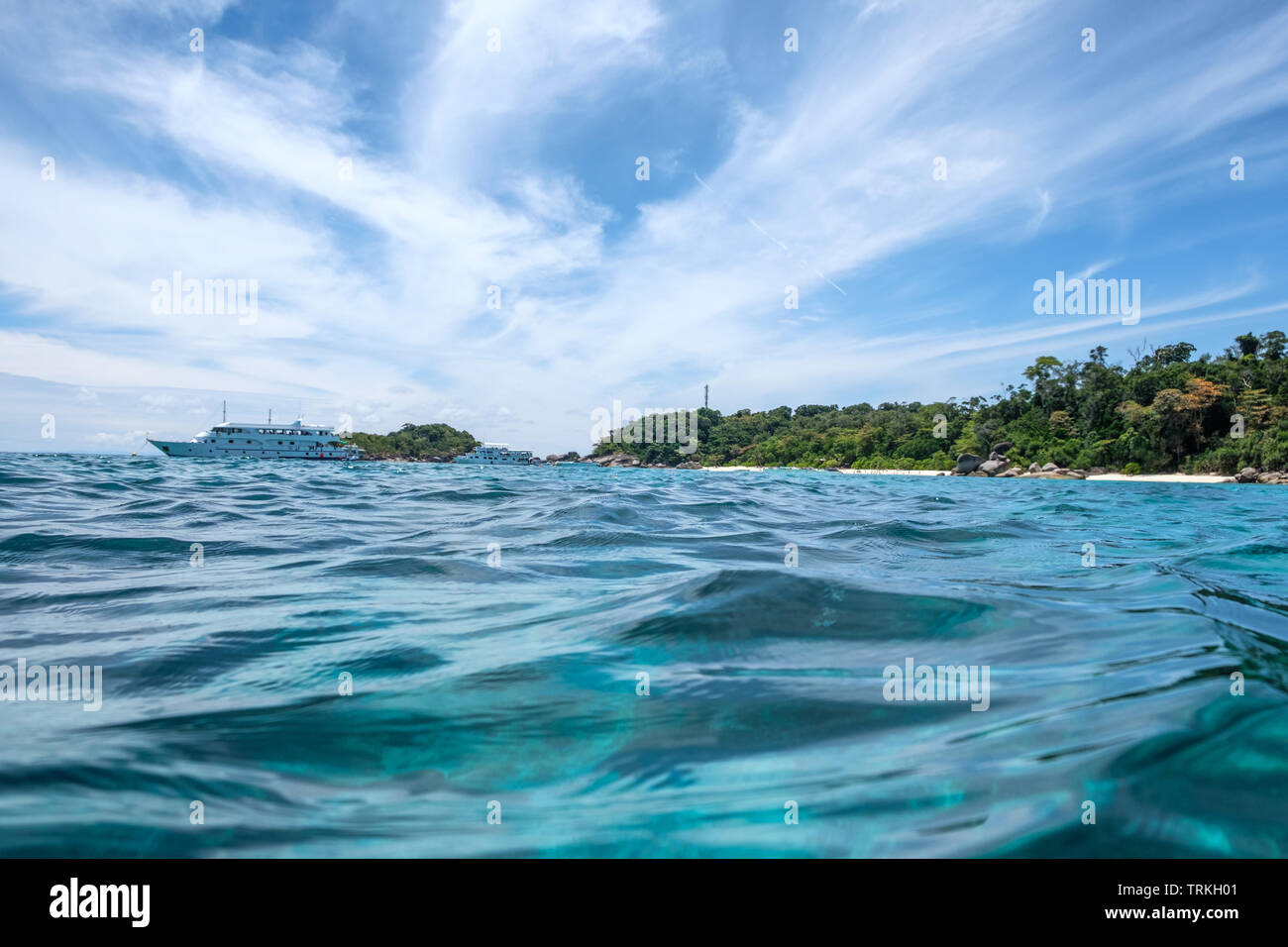 Beautiful blue wave ripple with ferry in andaman sea Stock Photo - Alamy