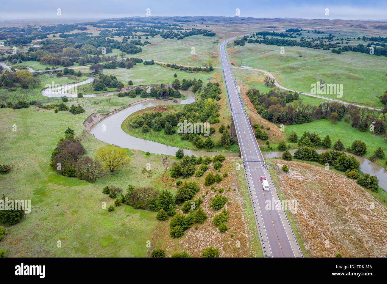 aerial view of a highway and bridge over the Dismal River in Nebraska ...