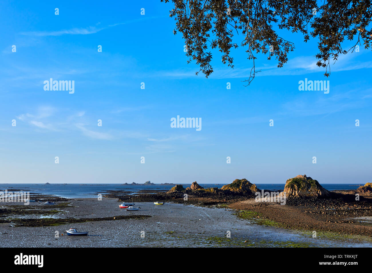 Image of La Hocq Harbour at half tide with rocks and sand Stock Photo ...