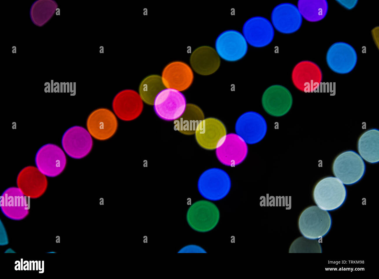 Colorful curved lines with lights of various colors with a Bokeh effect ...