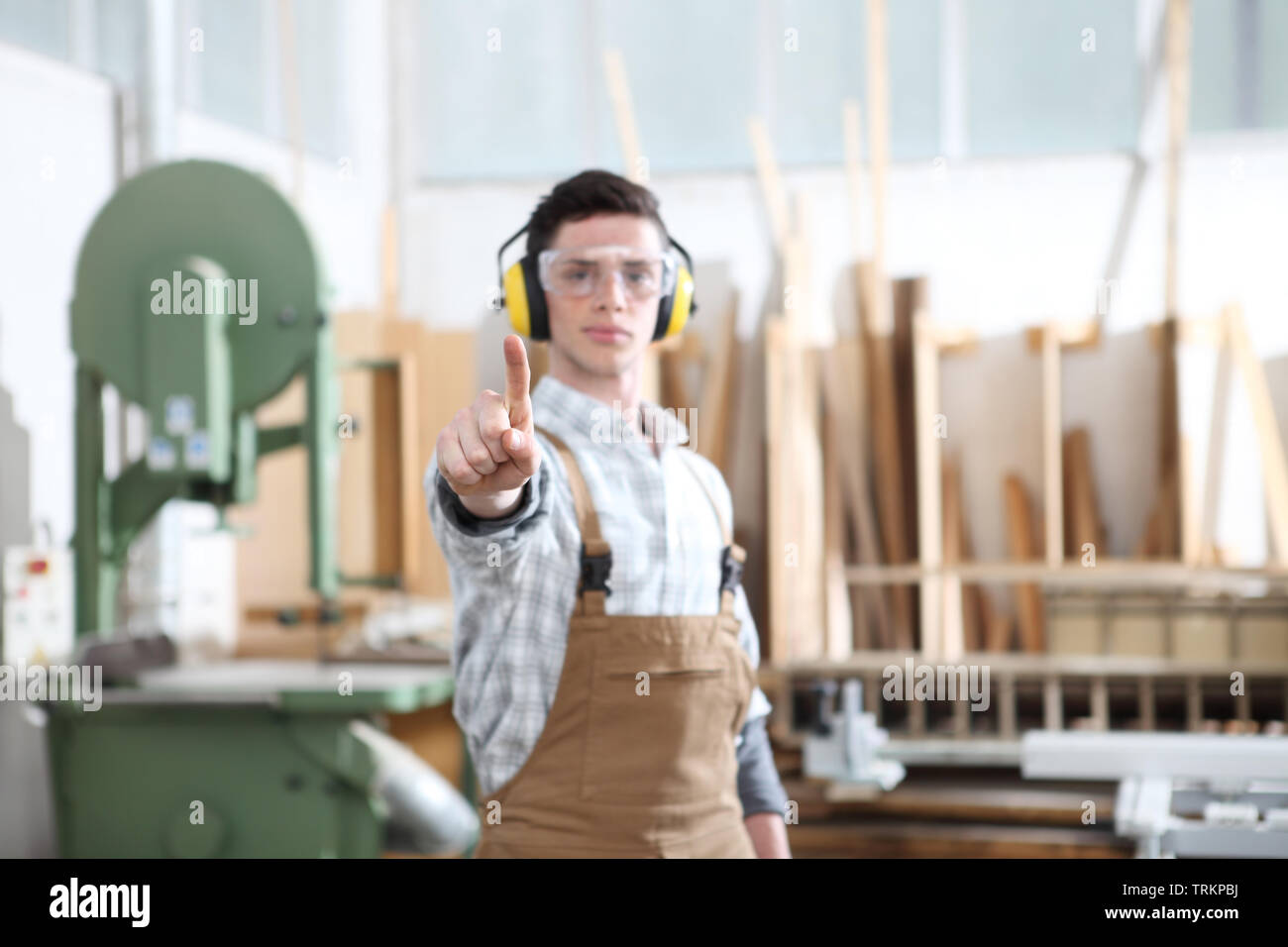 carpenter man touch screen on carpentry background Stock Photo - Alamy