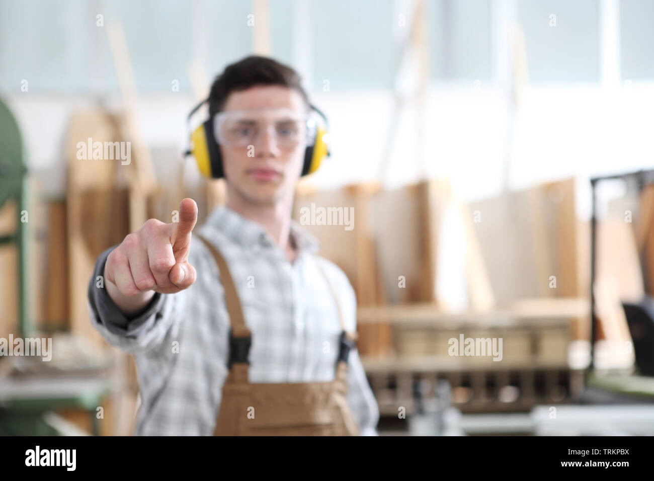 carpenter man touch screen on carpentry background Stock Photo - Alamy