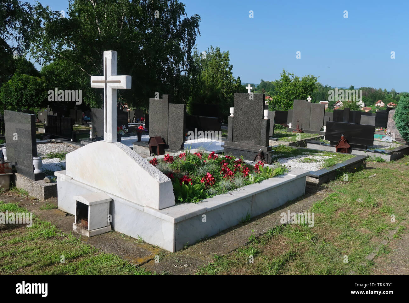 Marble tombstone on a cemetery Stock Photo - Alamy