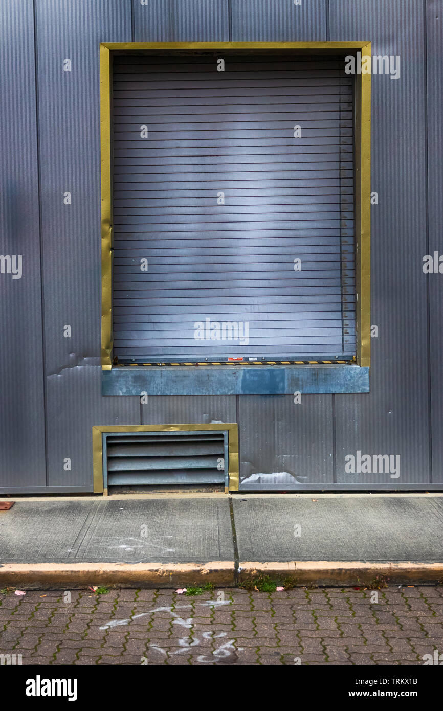 Warehouse loading dock with garage door in daylight Stock Photo - Alamy