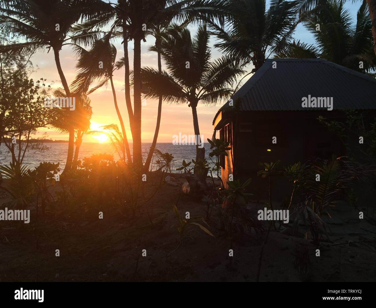 Ocean getaway in sunset on Fiji Islands Stock Photo - Alamy