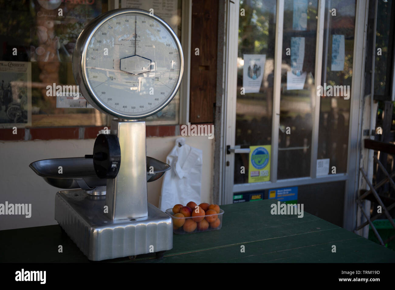 weight scale with a basket of apricots on the side. Local market Stock ...