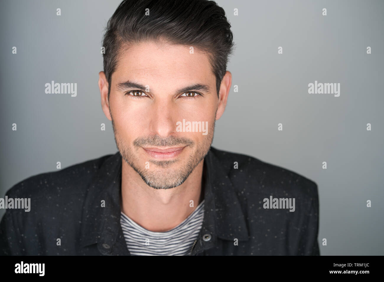 Confident smiling male model hi-res stock photography and images - Alamy