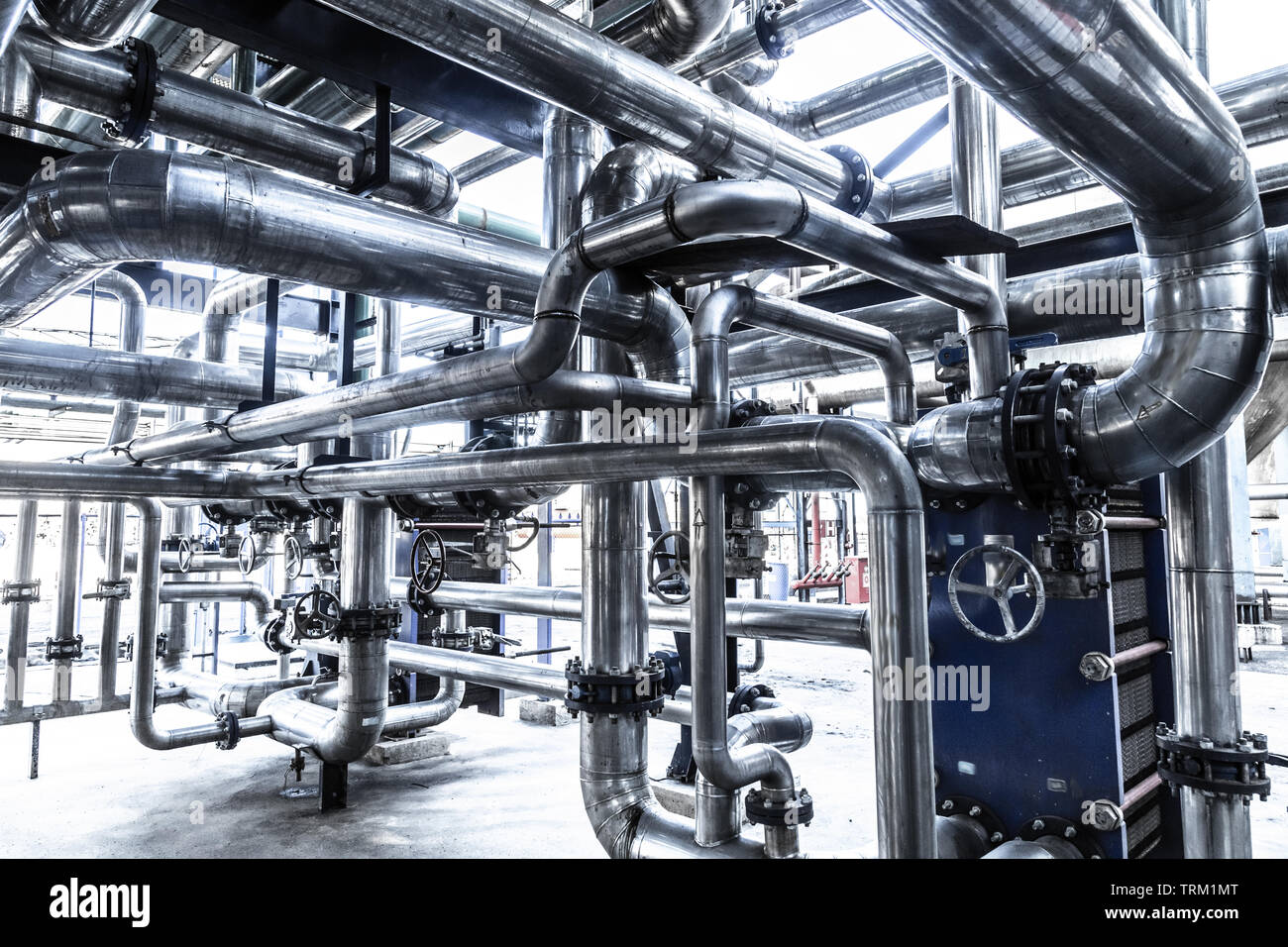 industrial steam pipe with valves and stainless steel actuators Stock ...