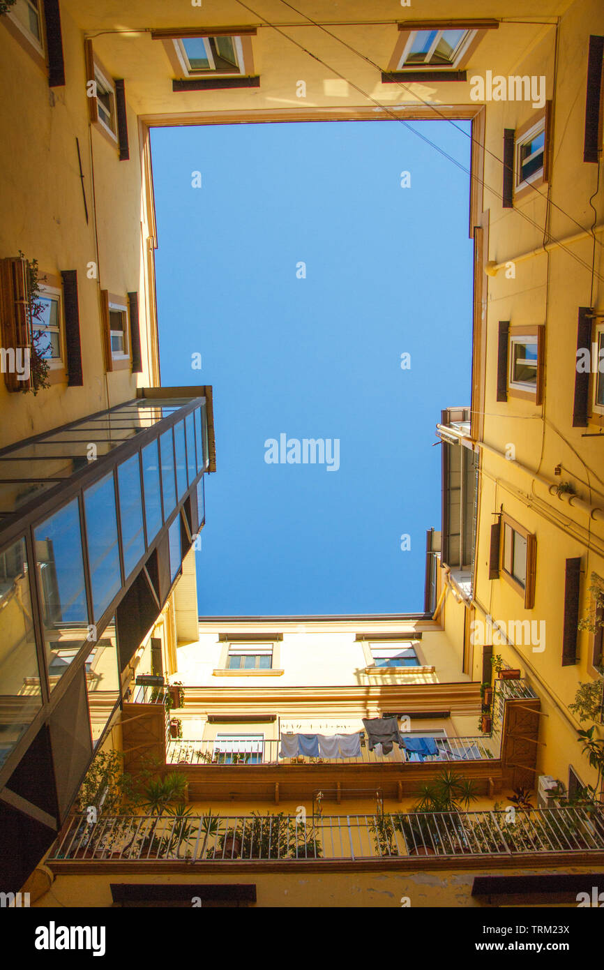 Travel to Italy bottom view of square sky from patio of urban house in ...